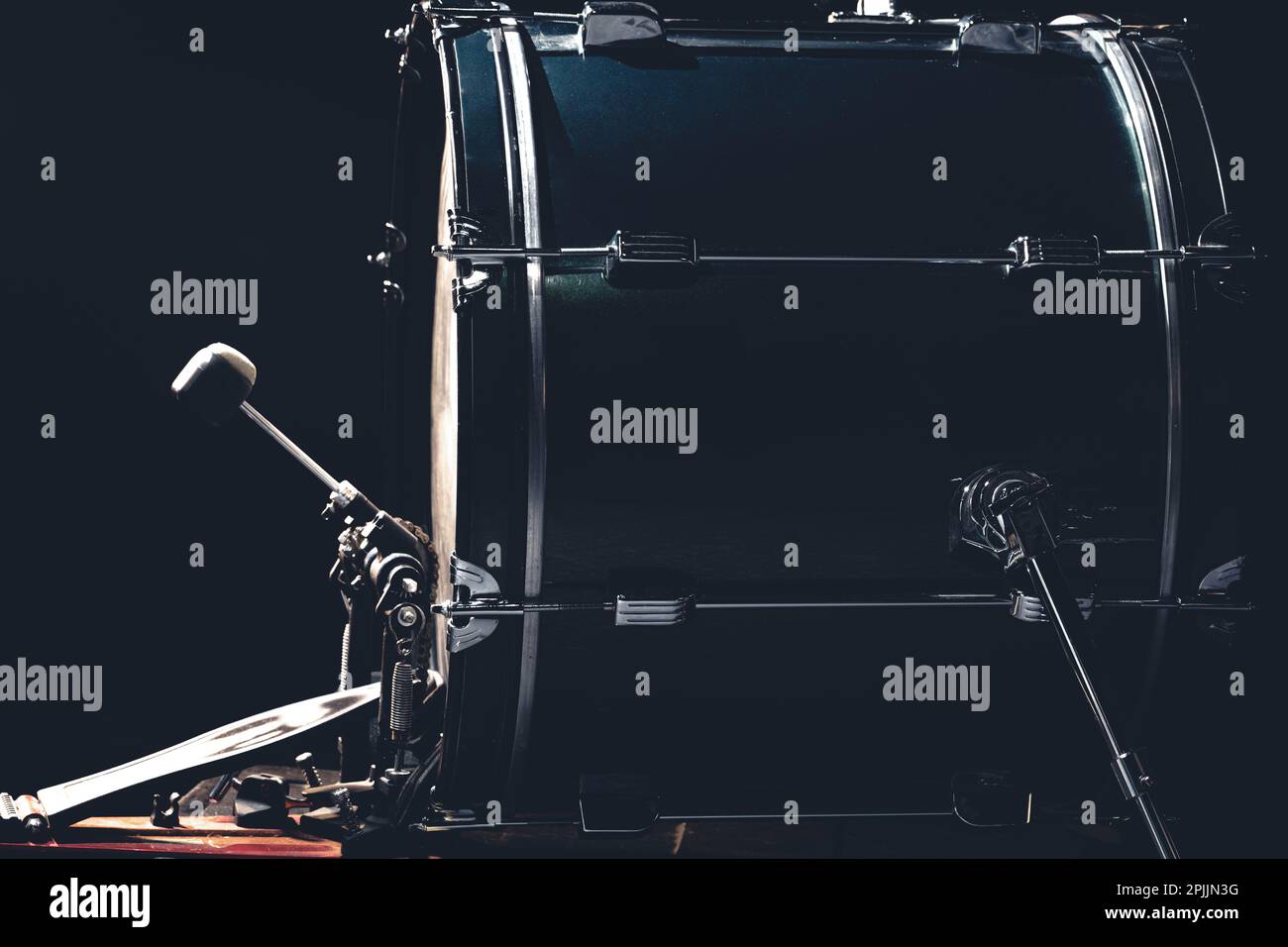 Bass drum with pedal, musical instrument on black background Stock ...
