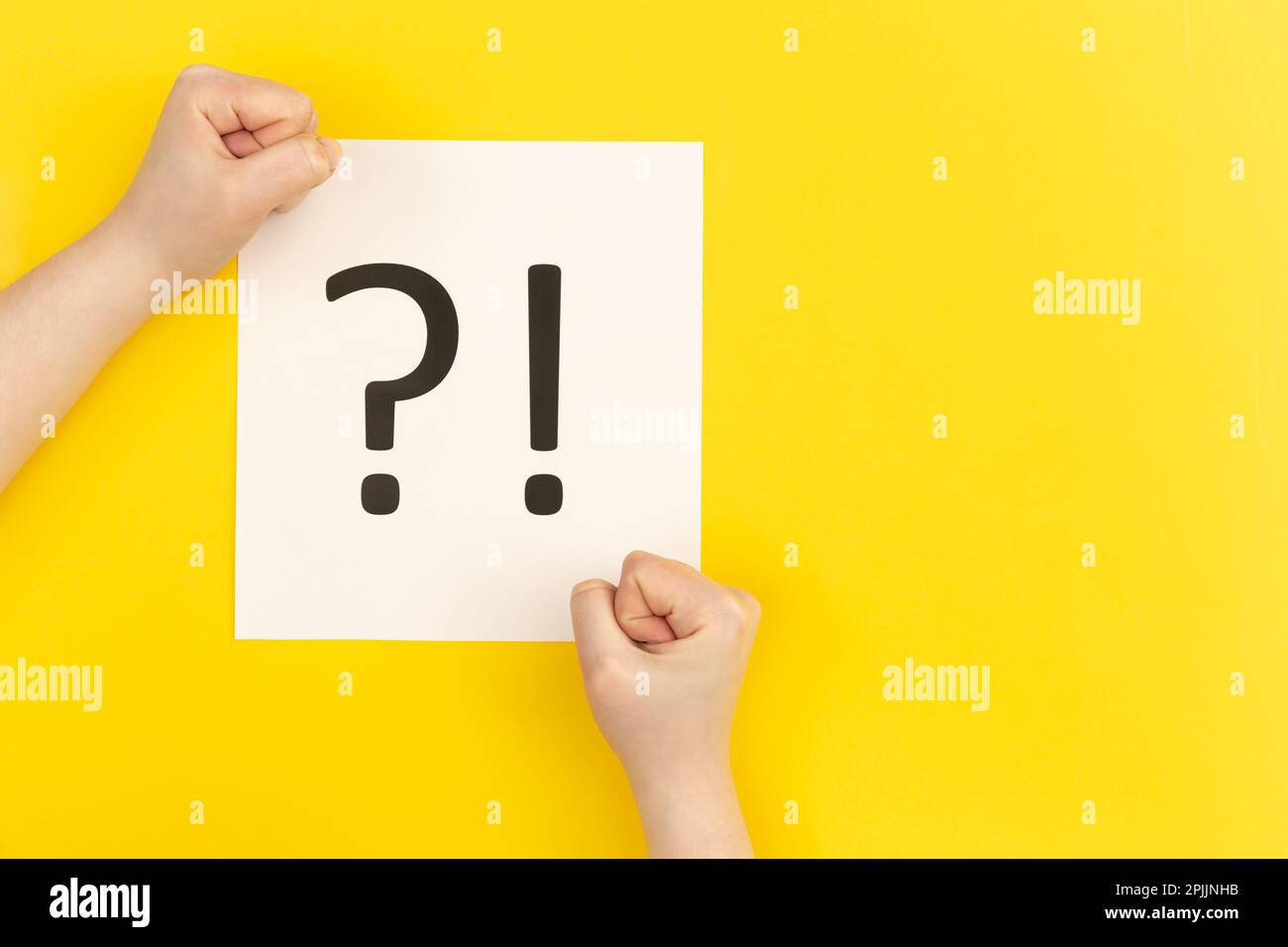Question mark and exclamation mark on yellow background, flat lay Stock ...