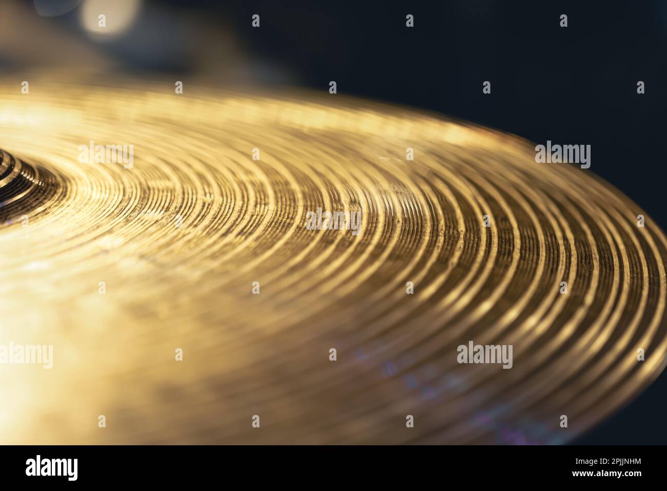Drum cymbal close-up on a dark background Stock Photo - Alamy