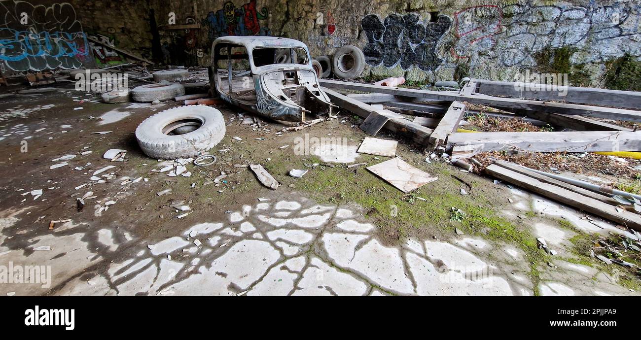 Car wreck in an industrial wasteland, La Fourvoirie, Guiers-Mort Valley ...
