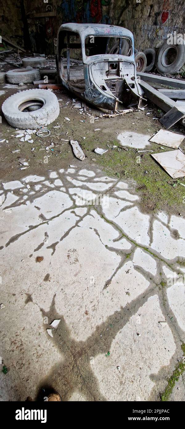 Car wreck in an industrial wasteland, La Fourvoirie, Guiers-Mort Valley ...