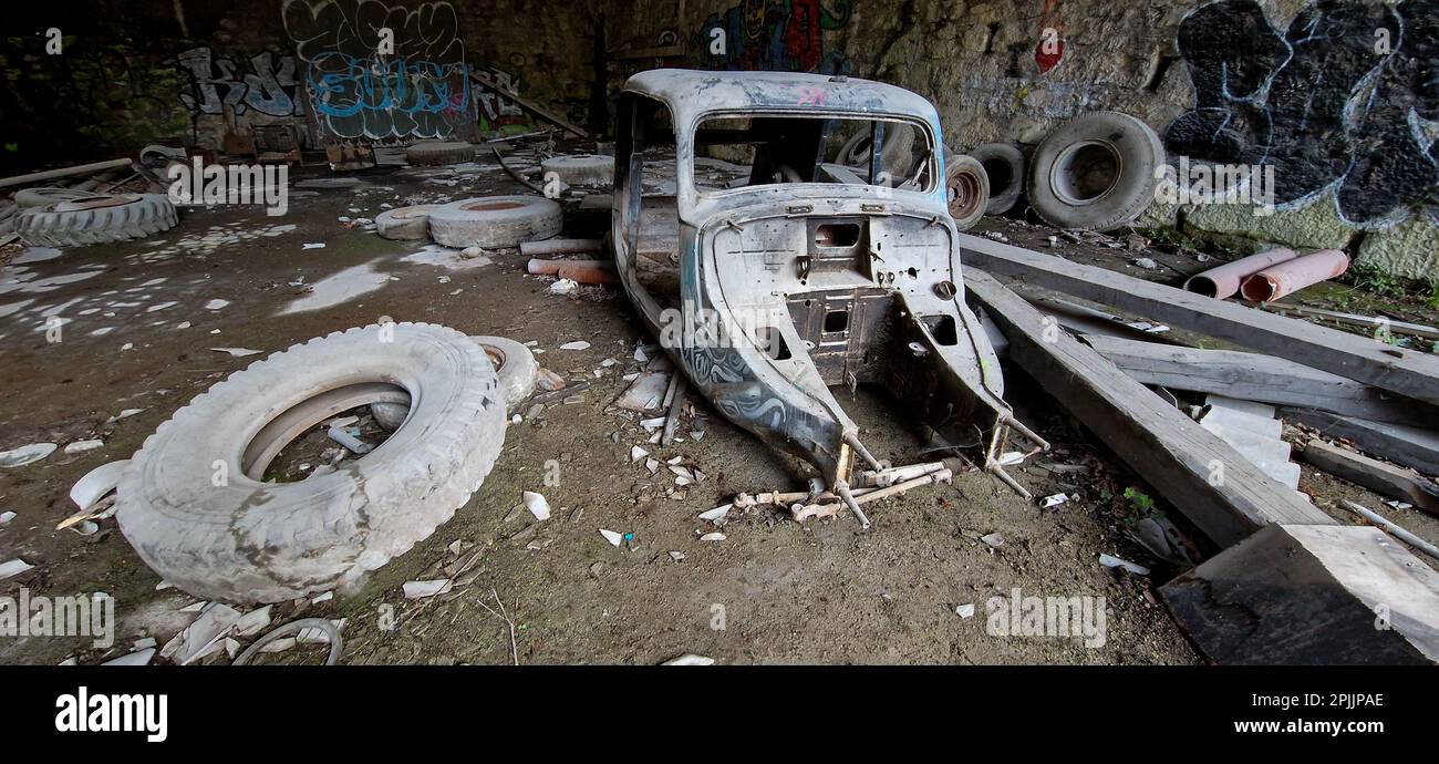 Car wreck in an industrial wasteland, La Fourvoirie, Guiers-Mort Valley ...