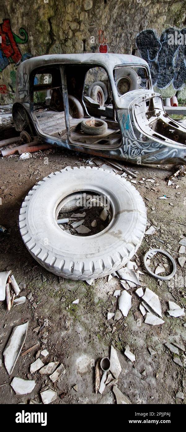 Car wreck in an industrial wasteland, La Fourvoirie, Guiers-Mort Valley ...