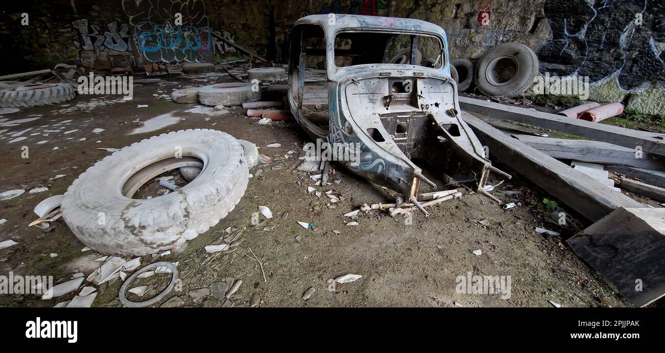 Car wreck in an industrial wasteland, La Fourvoirie, Guiers-Mort Valley ...