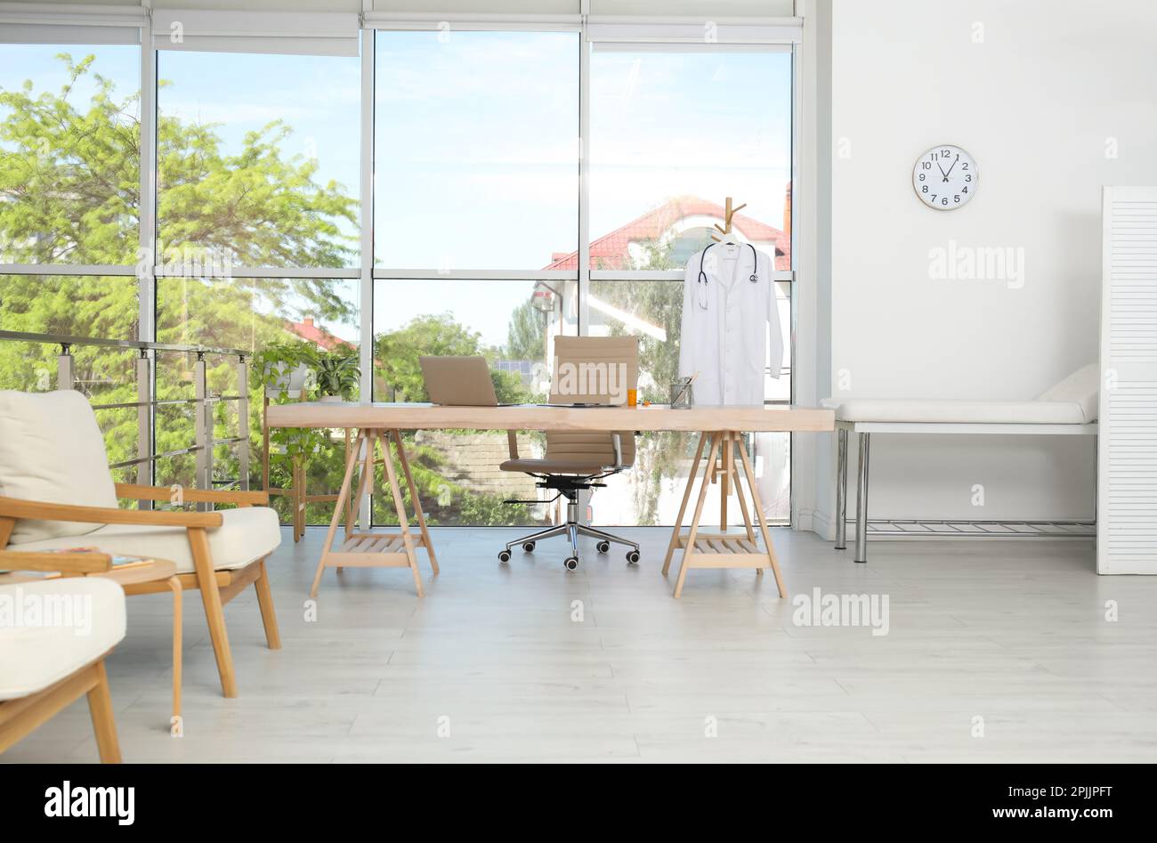 Modern medical office interior with doctor's workplace near window ...