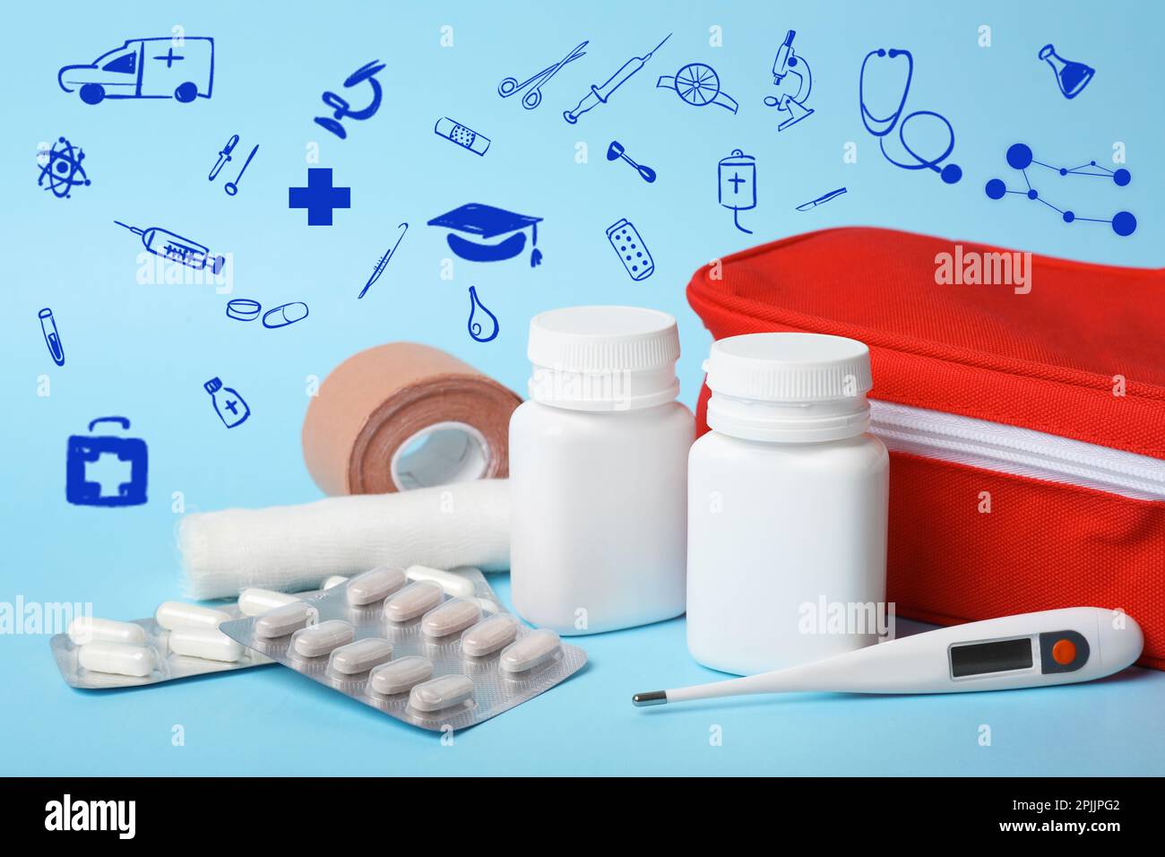 First aid kit and different images on light blue background Stock Photo ...