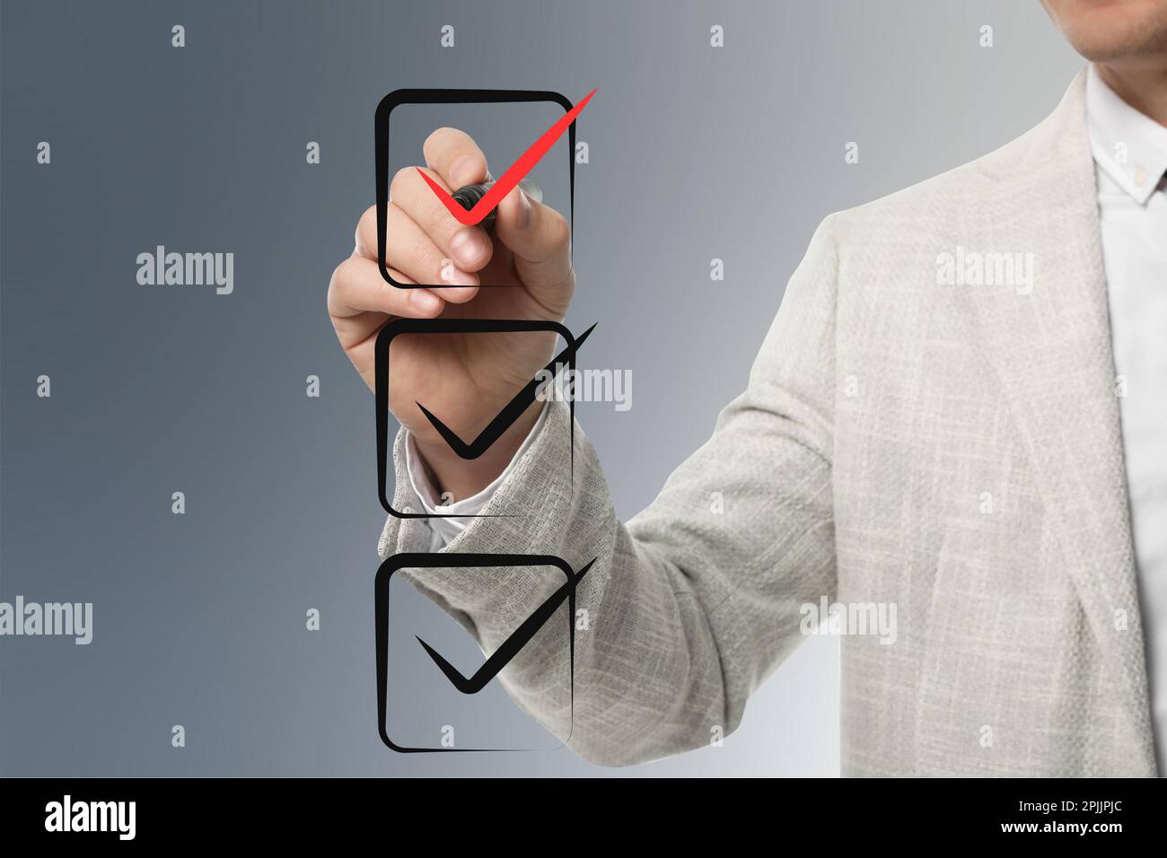 Man pointing at red check mark in box on virtual screen, closeup Stock ...