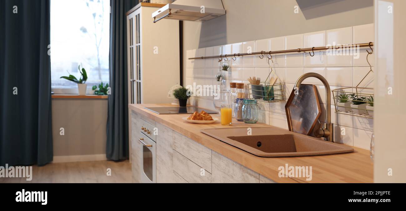 Modern kitchen interior with new stylish furniture. Banner design Stock ...