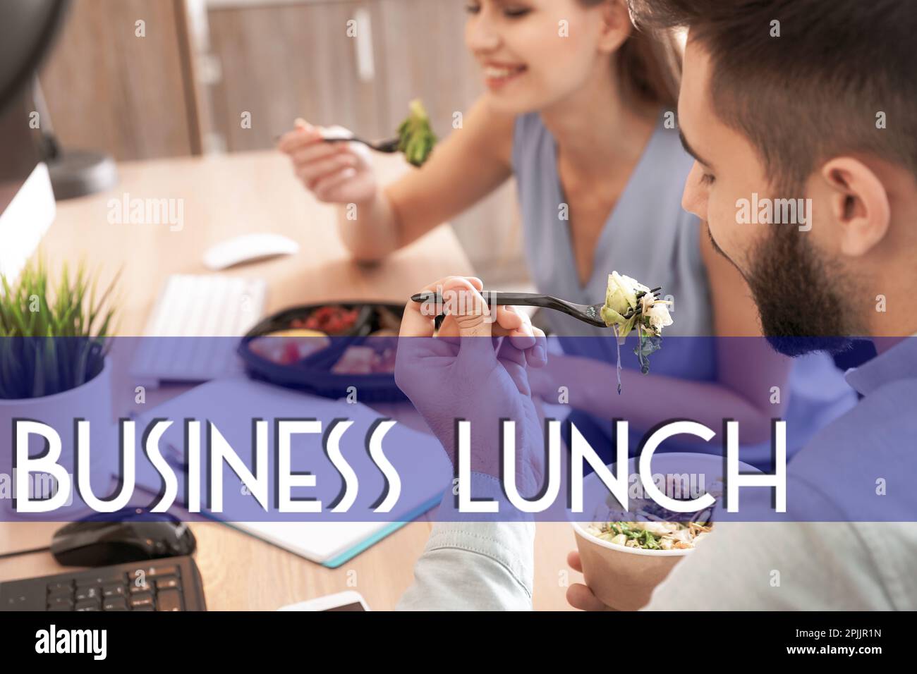 Office employees eating at workplace. Business lunch Stock Photo - Alamy