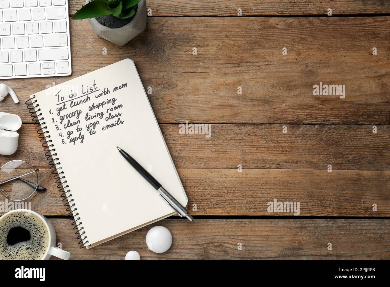 Flat lay composition with to do list on wooden table, space for text ...