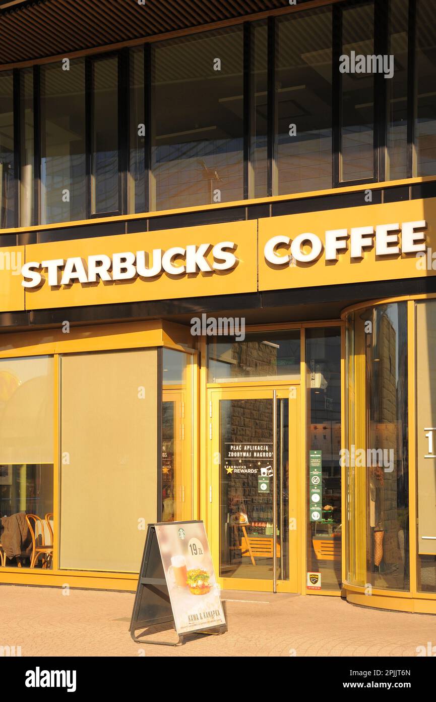 WARSAW, POLAND - MARCH 22, 2022: Starbucks coffee shop on city street ...