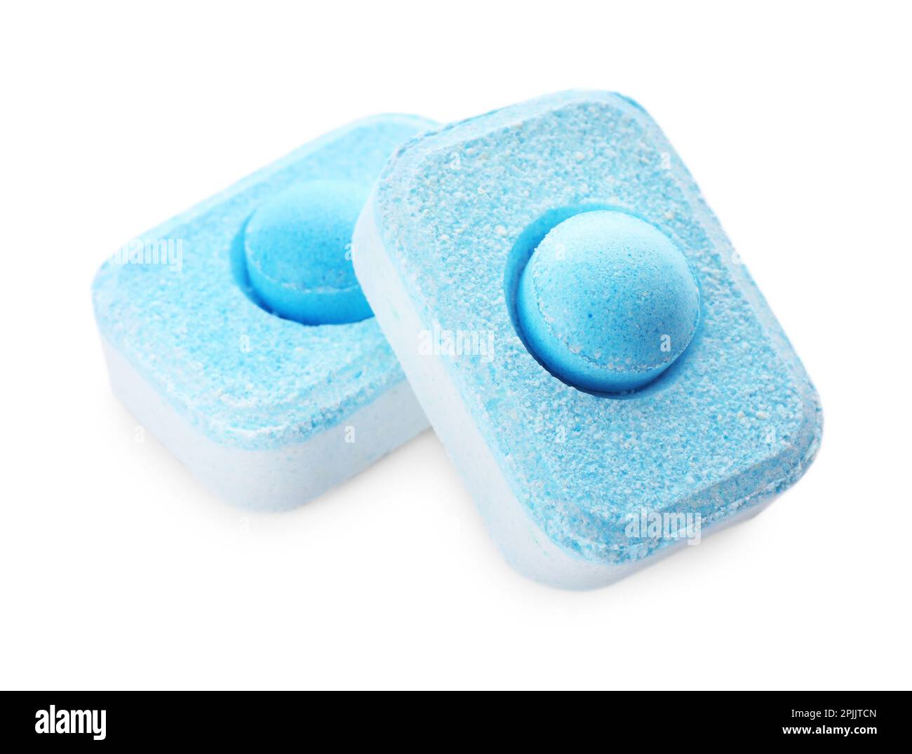 Two water softener tablets isolated on white Stock Photo - Alamy