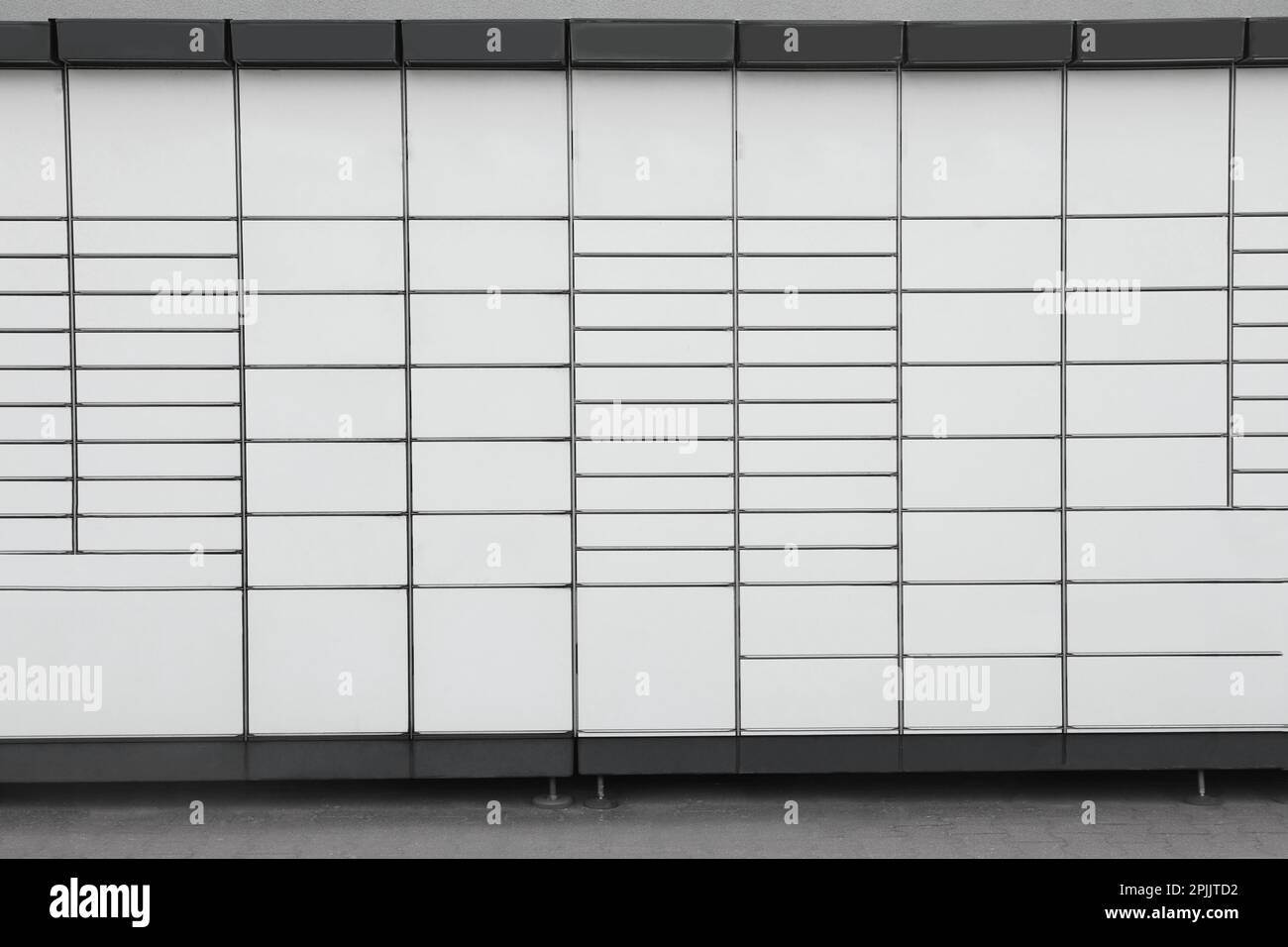 Modern parcel locker with many postal boxes Stock Photo - Alamy