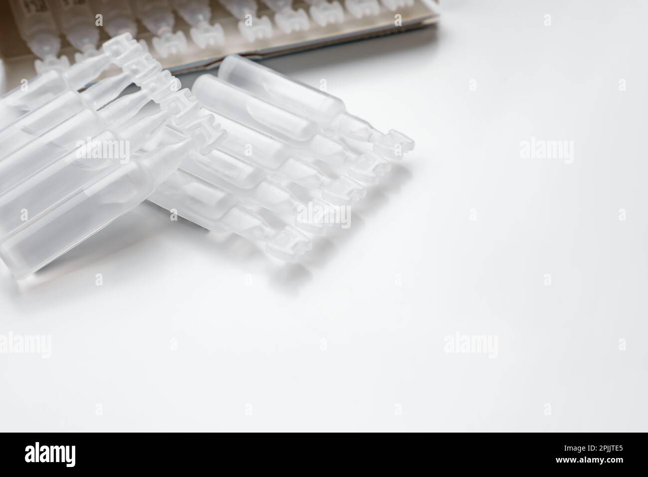 Single dose ampoules of sterile isotonic sea water solution on white ...