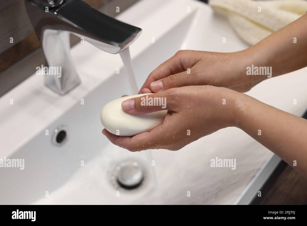 Woman washing hands bar soap hi-res stock photography and images - Alamy