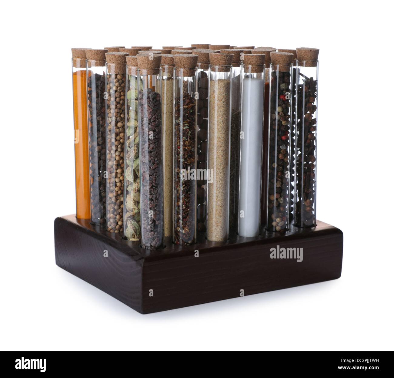 Glass tubes with different spices in rack on white background Stock ...
