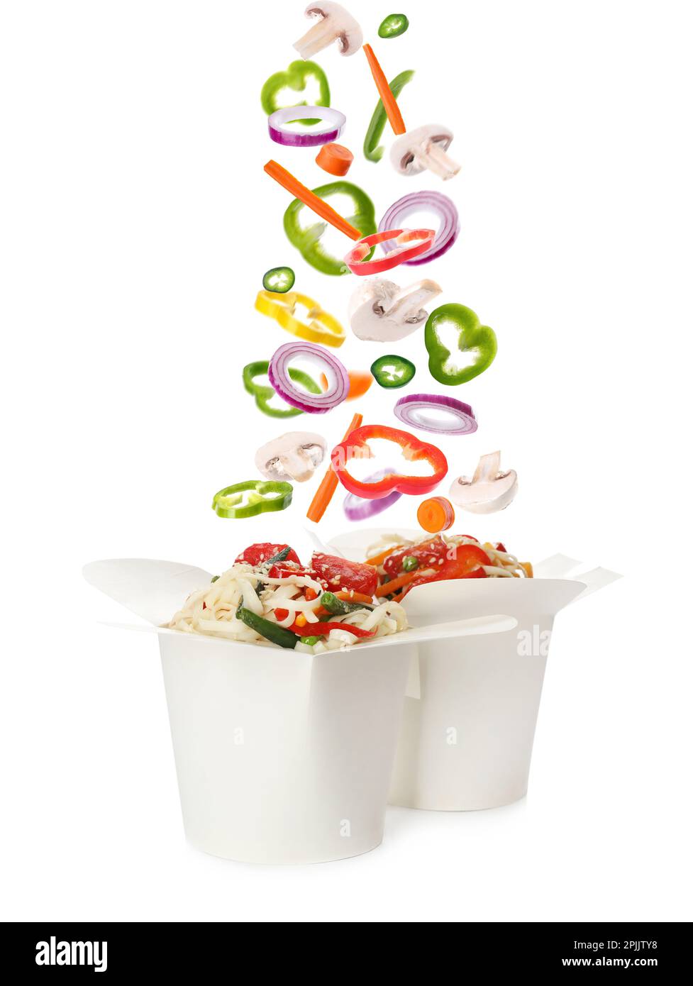 DIfferent fresh ingredients falling into boxes of wok noodles on white ...