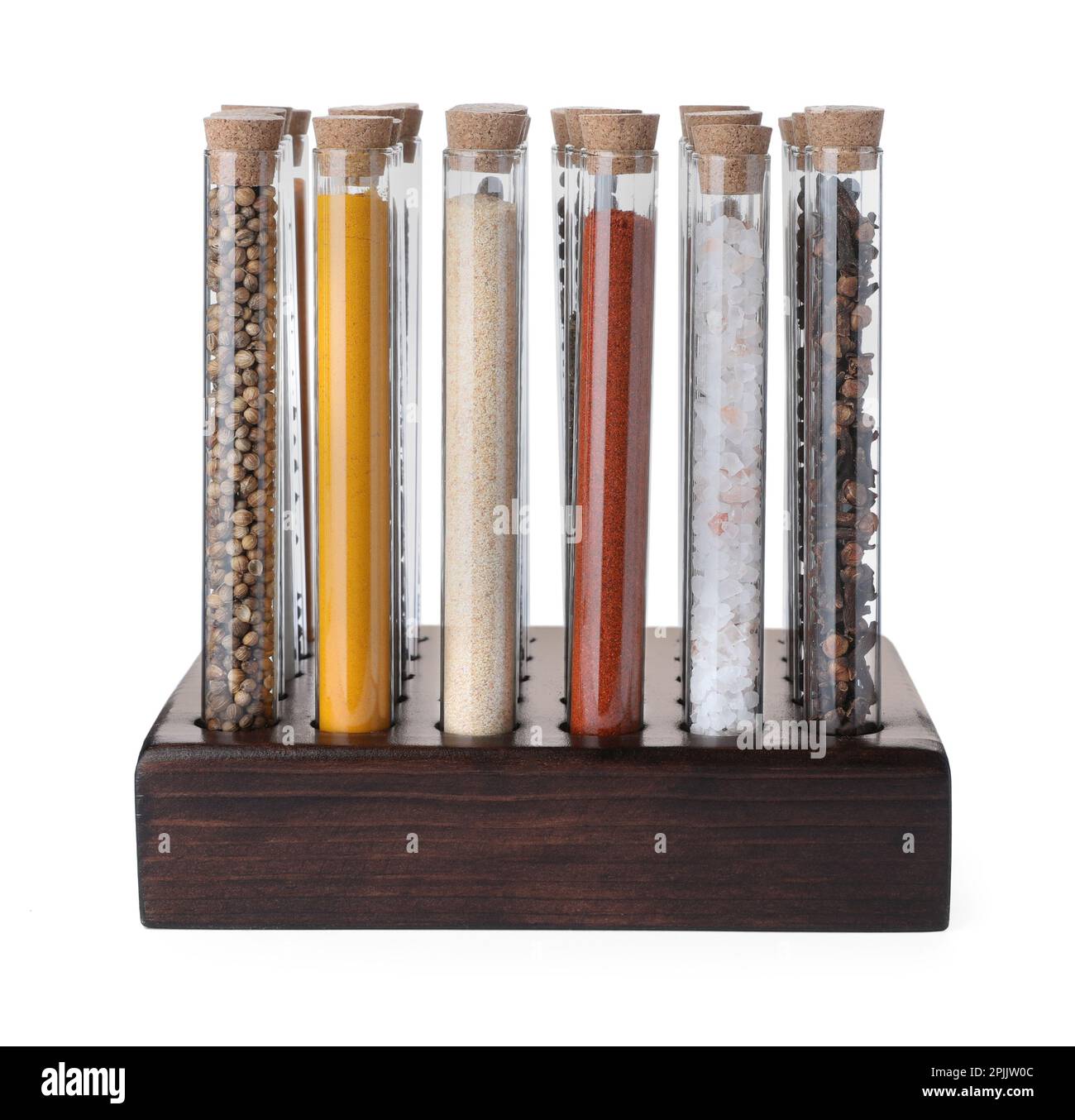 Glass tubes with different spices in rack on white background Stock ...