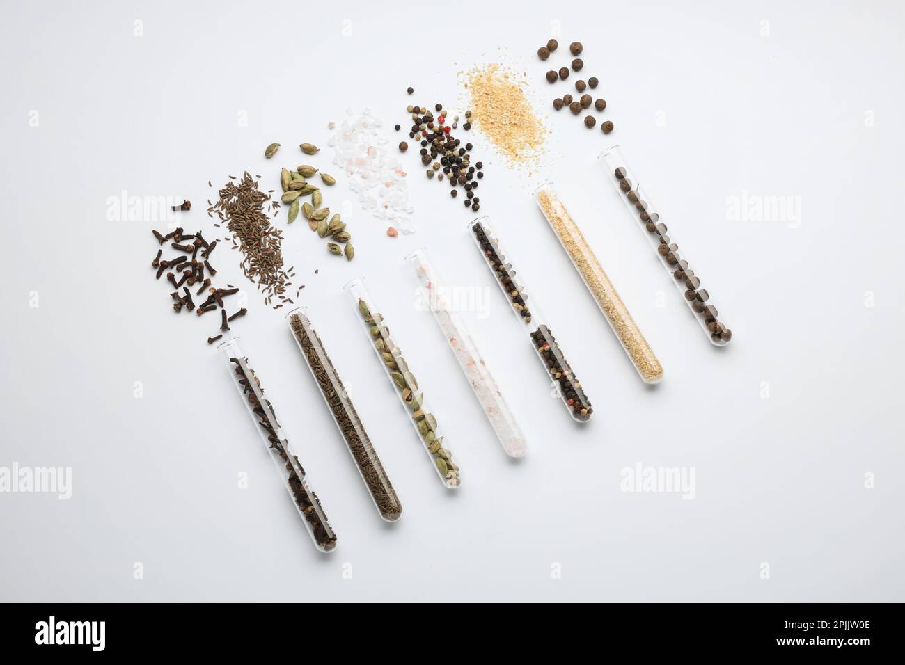 Test tubes with various spices on white background, flat lay Stock ...