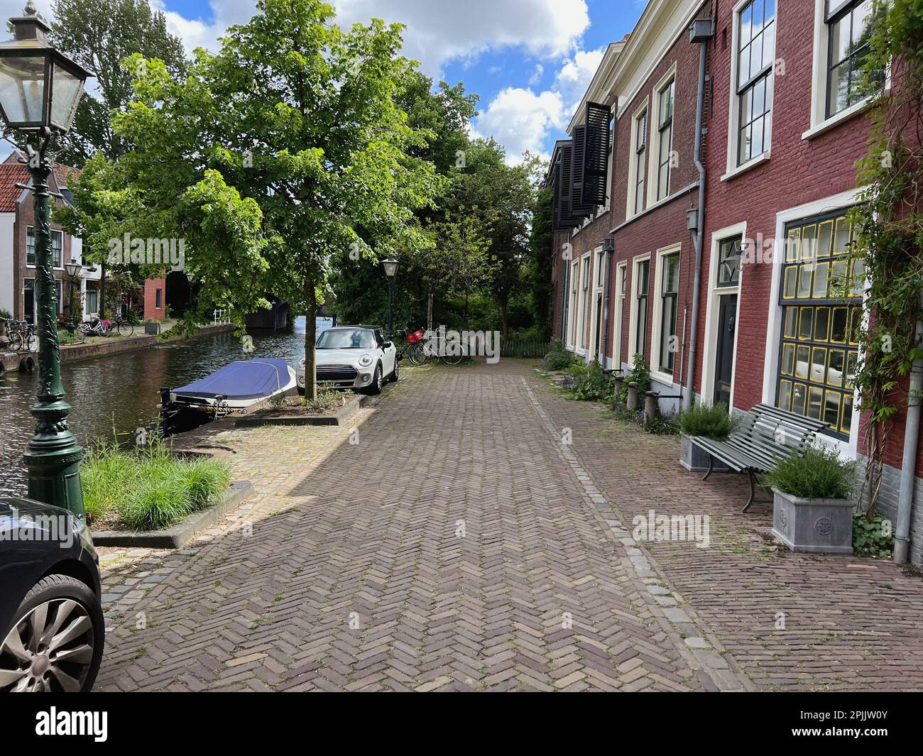 City street with beautiful buildings and canal Stock Photo - Alamy