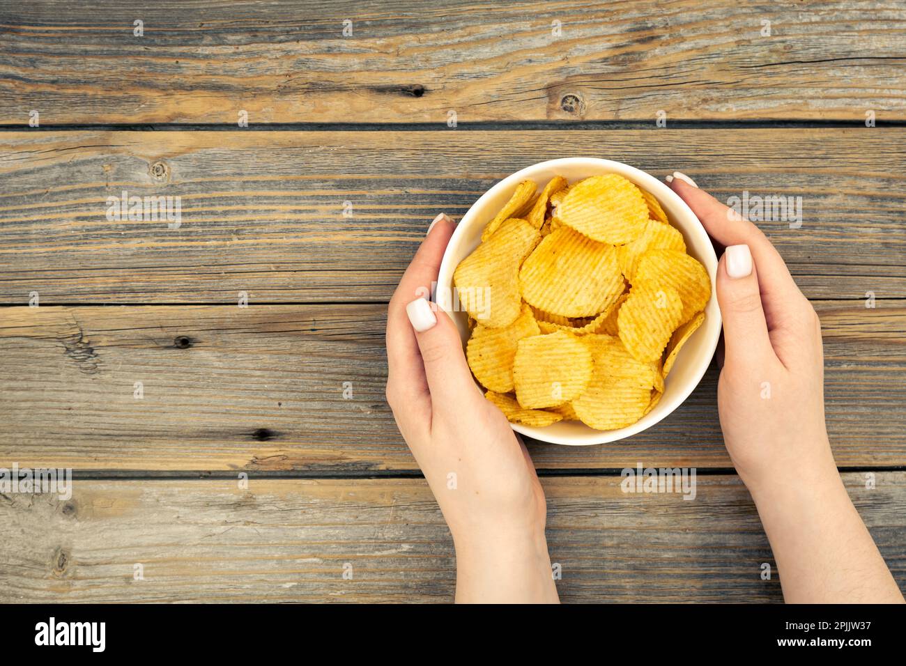 Woman eating plate baked potato hi-res stock photography and images - Alamy