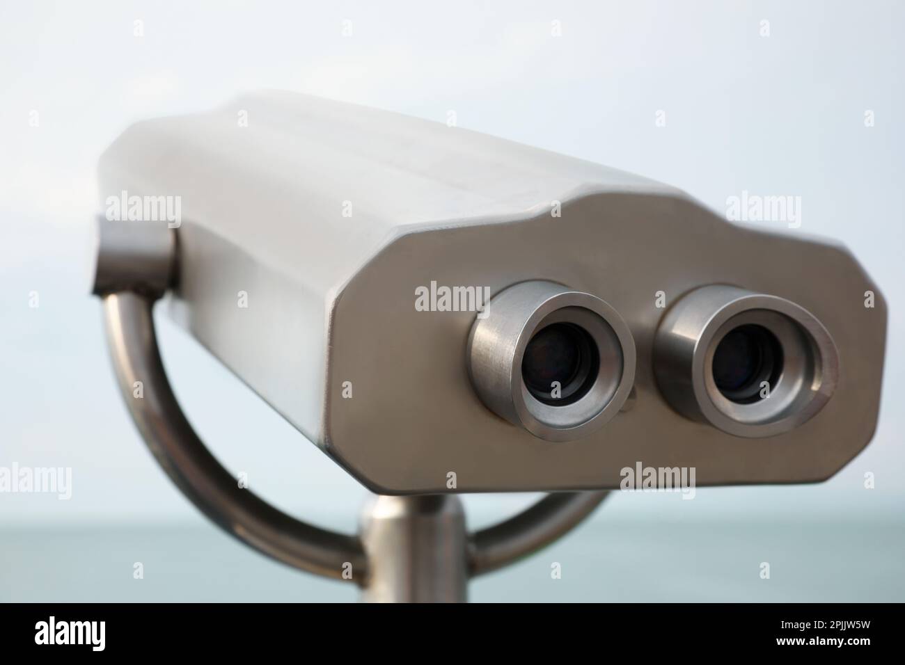 Metal tower viewer installed near sea. Mounted binoculars Stock Photo ...
