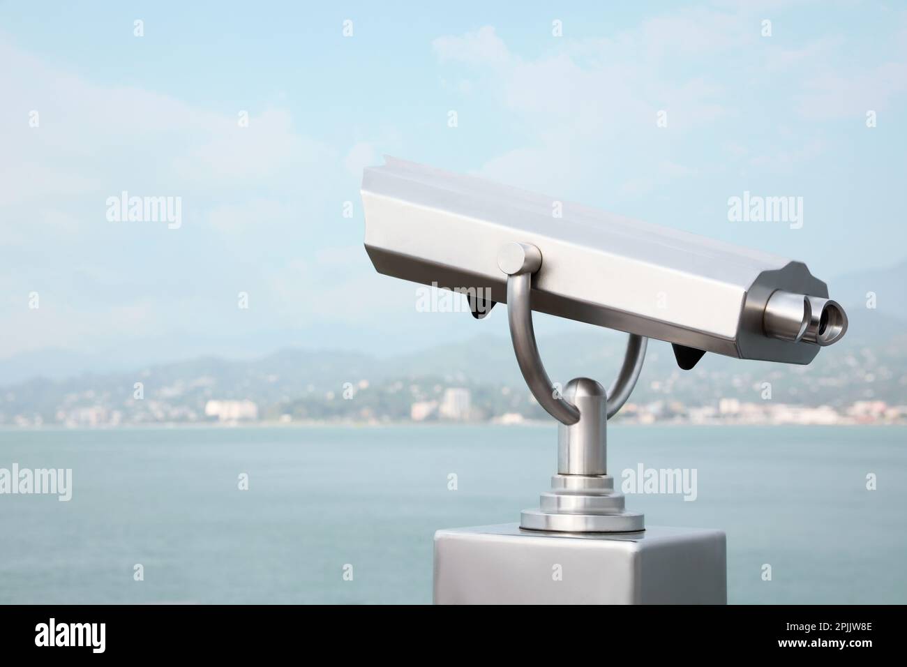 Metal tower viewer installed near sea, space for text. Mounted ...