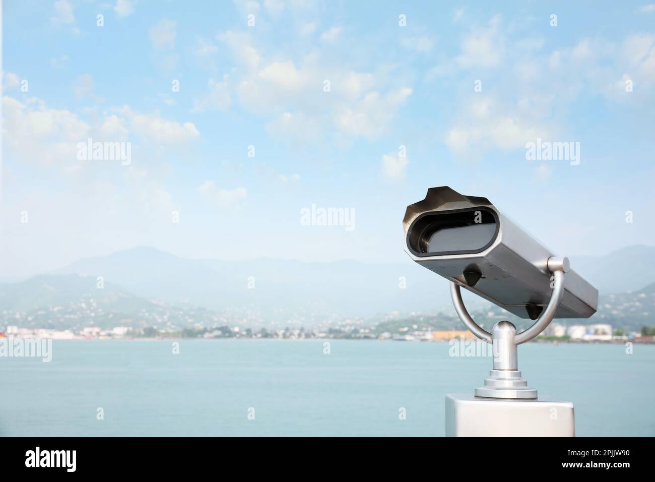Metal tower viewer installed near sea, space for text. Mounted ...