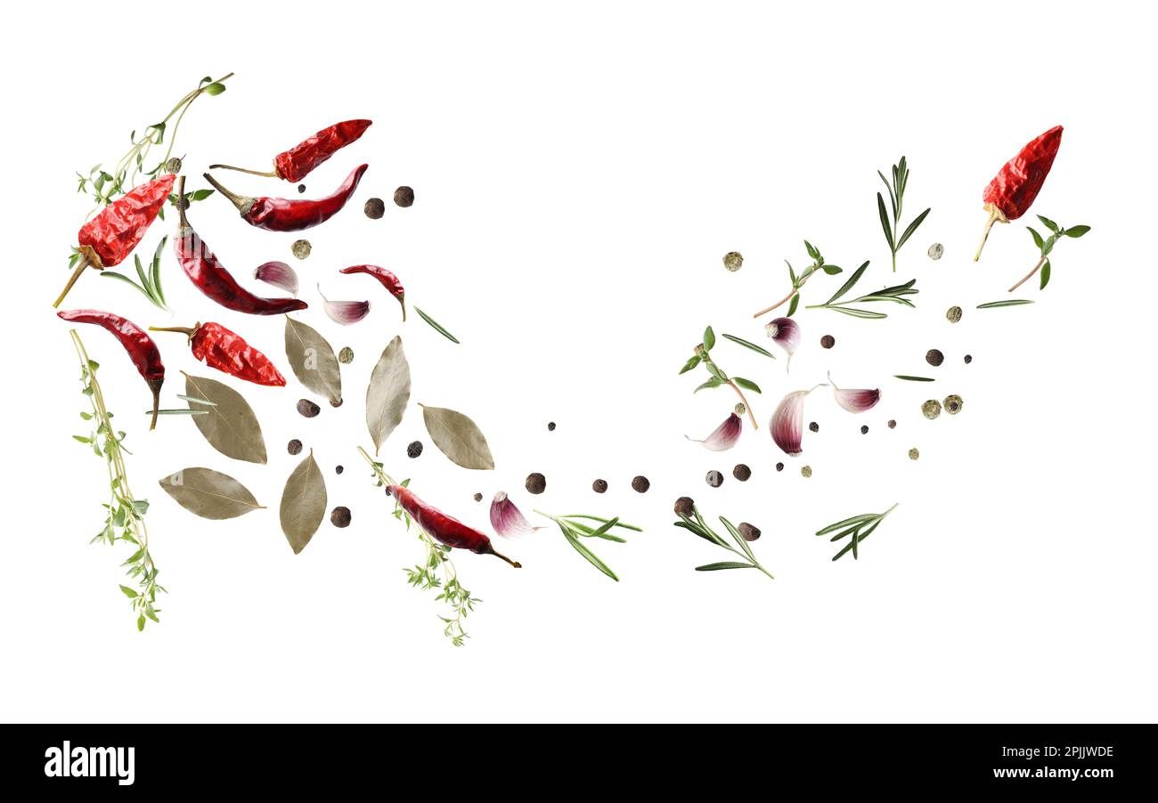 Many different spices flying on white background Stock Photo - Alamy