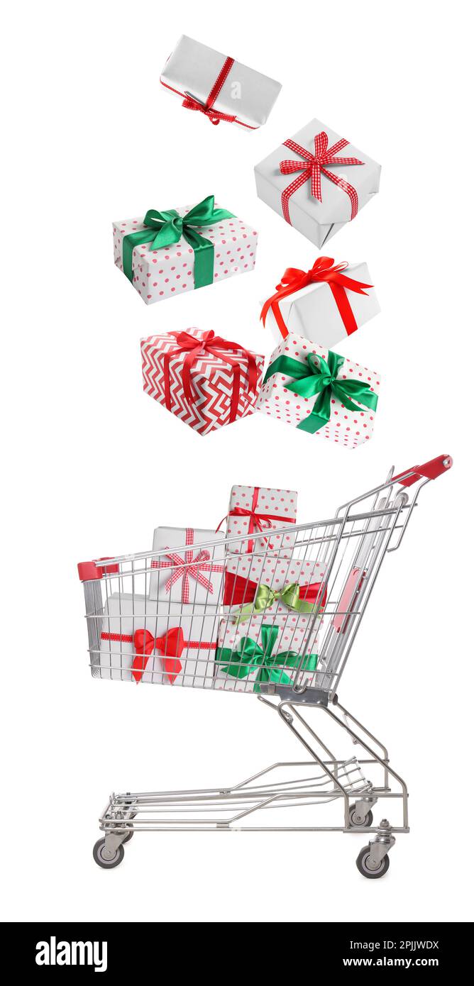 Beautifully wrapped gift boxes falling into metal shopping cart on ...