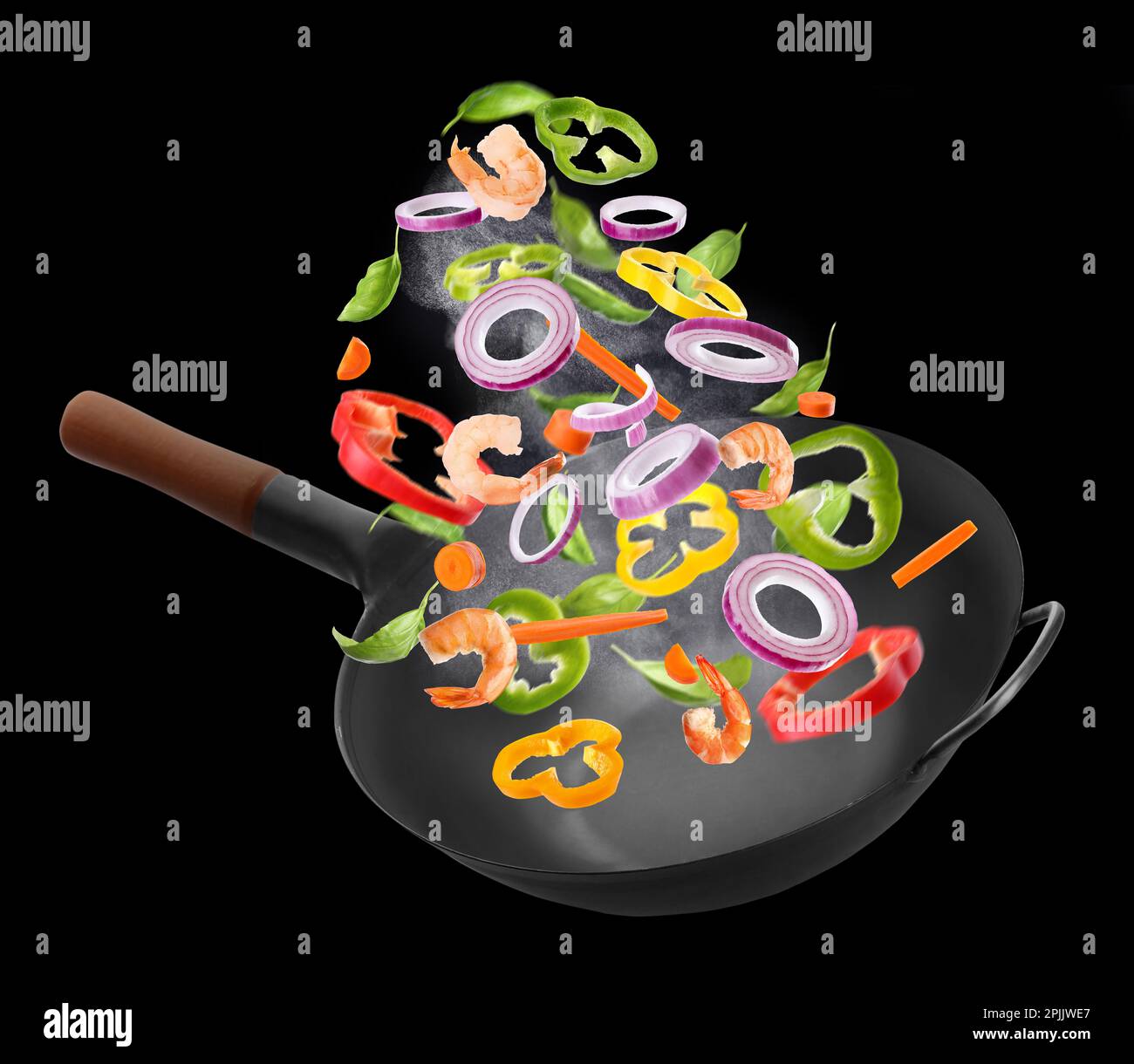 Different tasty ingredients falling into wok on black background Stock ...