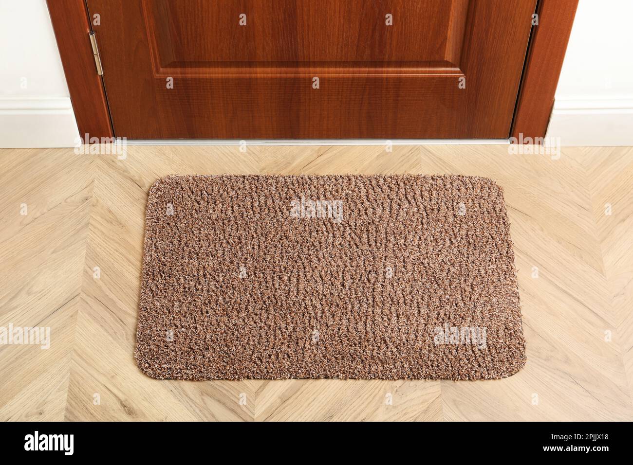 New clean rectangle mat near entrance door Stock Photo - Alamy