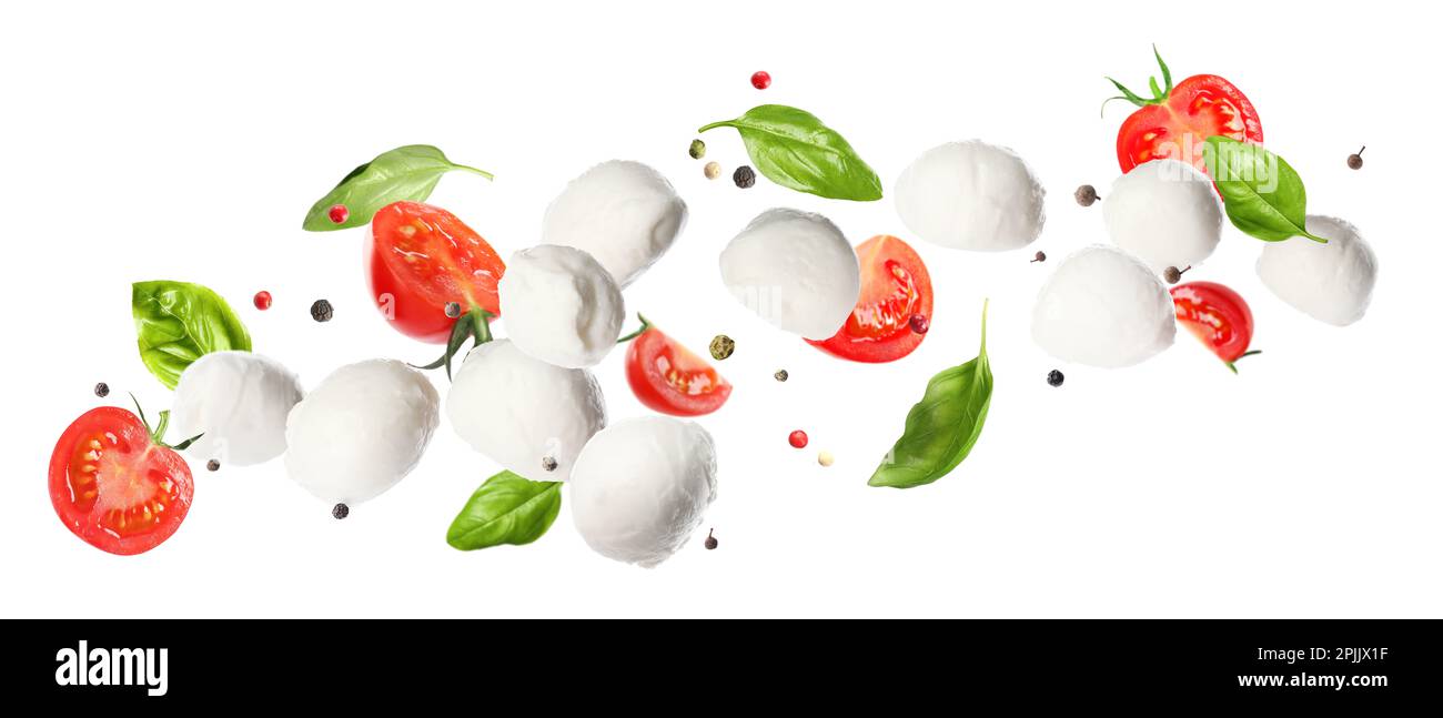 Mozzarella cheese balls, tomatoes, basil leaves and peppercorns for ...
