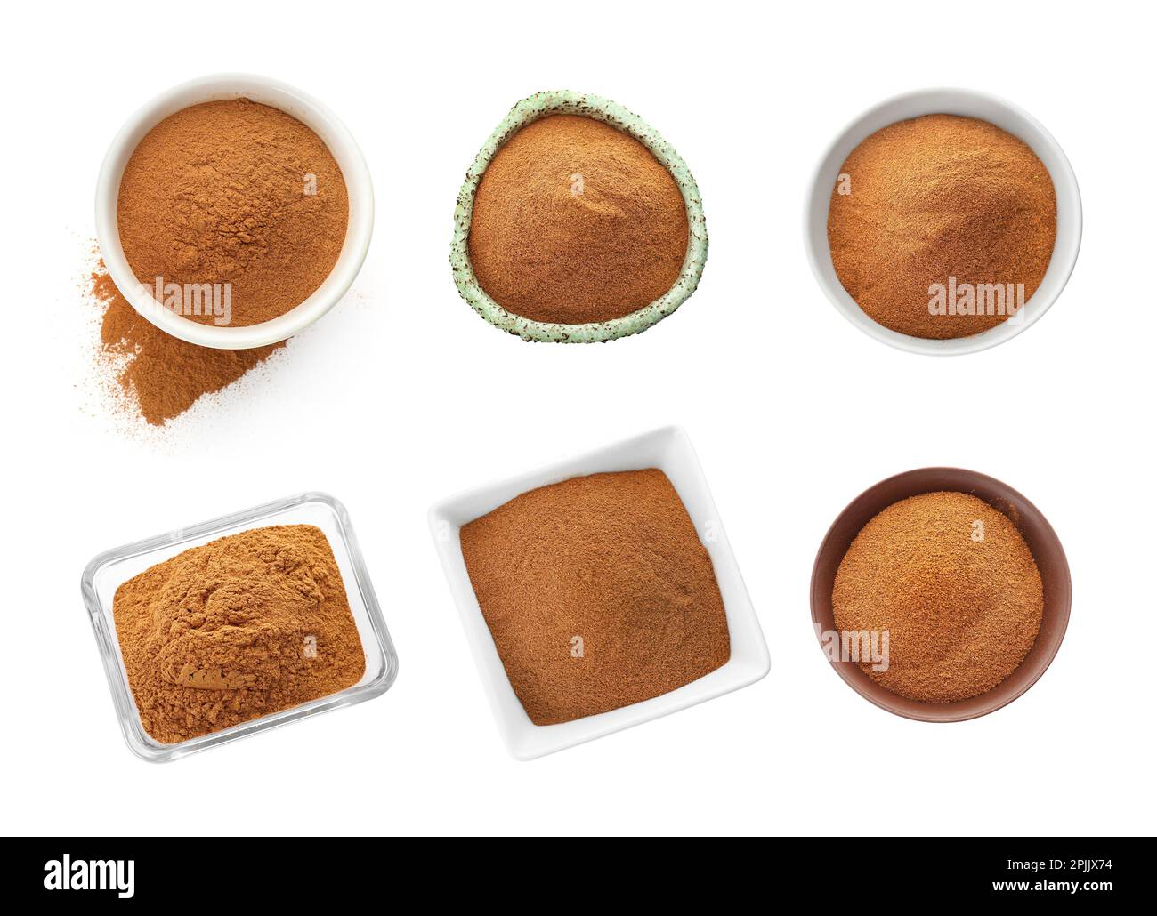 Set with aromatic cinnamon powder on white background, top view Stock ...