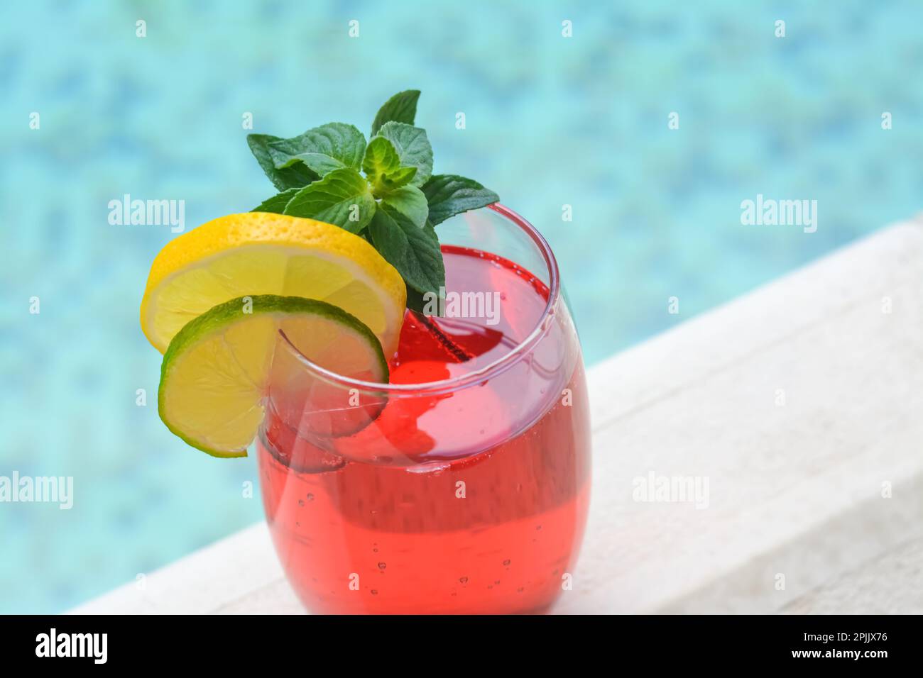 Cocktail fruit near swimming pool hi-res stock photography and images ...