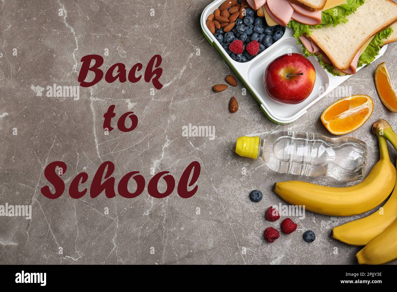 Flat lay composition with healthy food on brown marble table. School ...