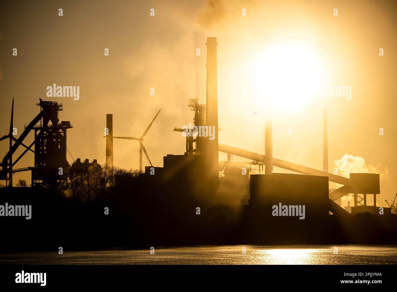 Bremen, Germany. 03rd Apr, 2023. The steel mill on the Weser at sunrise ...