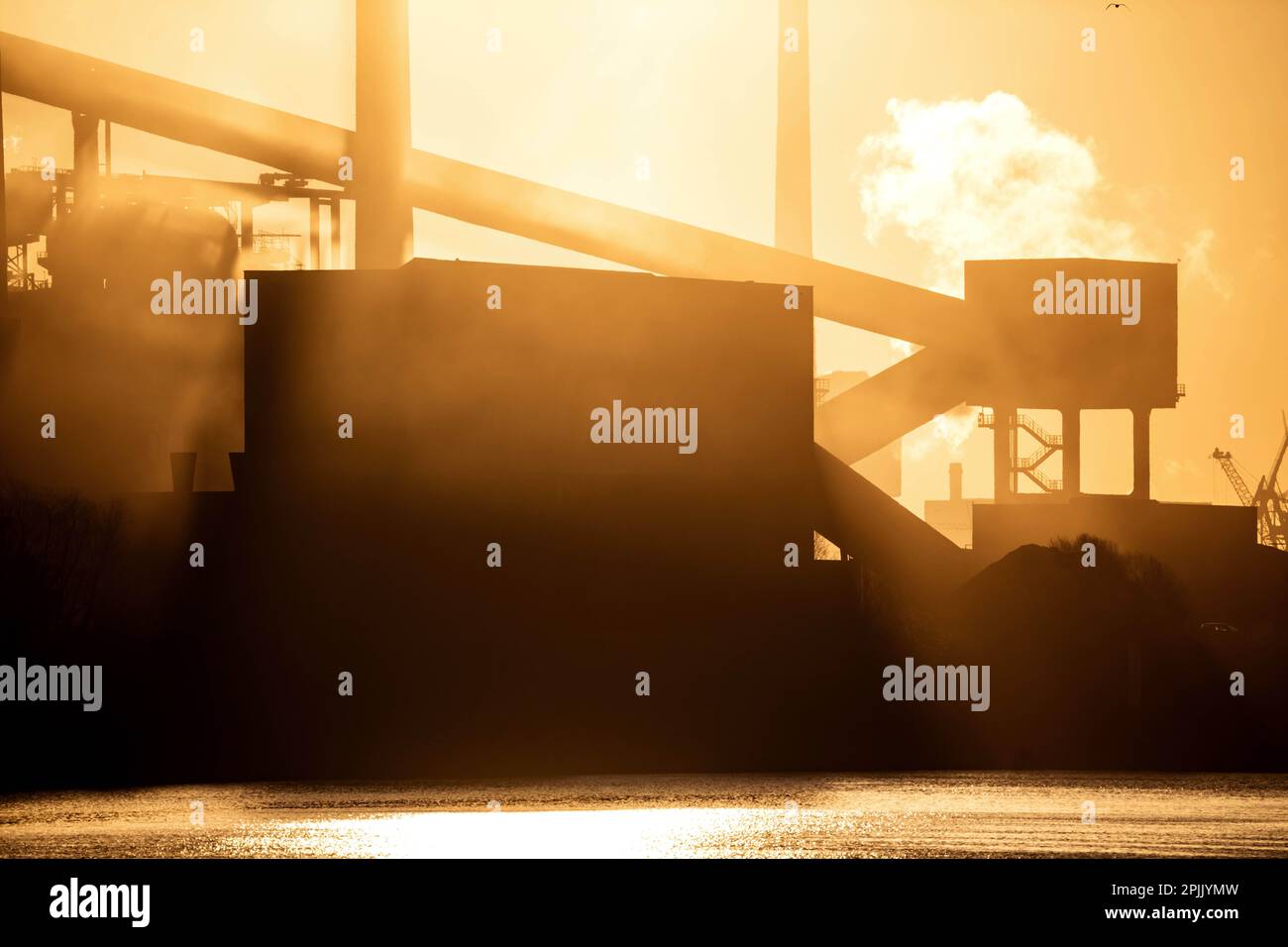 Bremen, Germany. 03rd Apr, 2023. The steel mill on the Weser at sunrise ...
