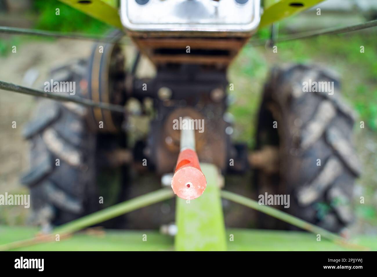 Gear lever on a walk-behind tractor close-up on a blurred background ...