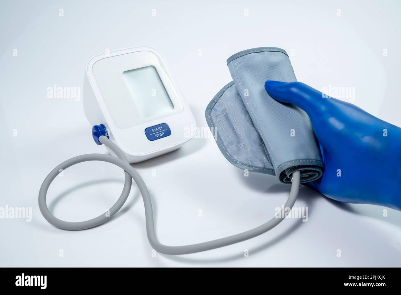 Doctor using sphygmomanometer hi-res stock photography and images - Alamy