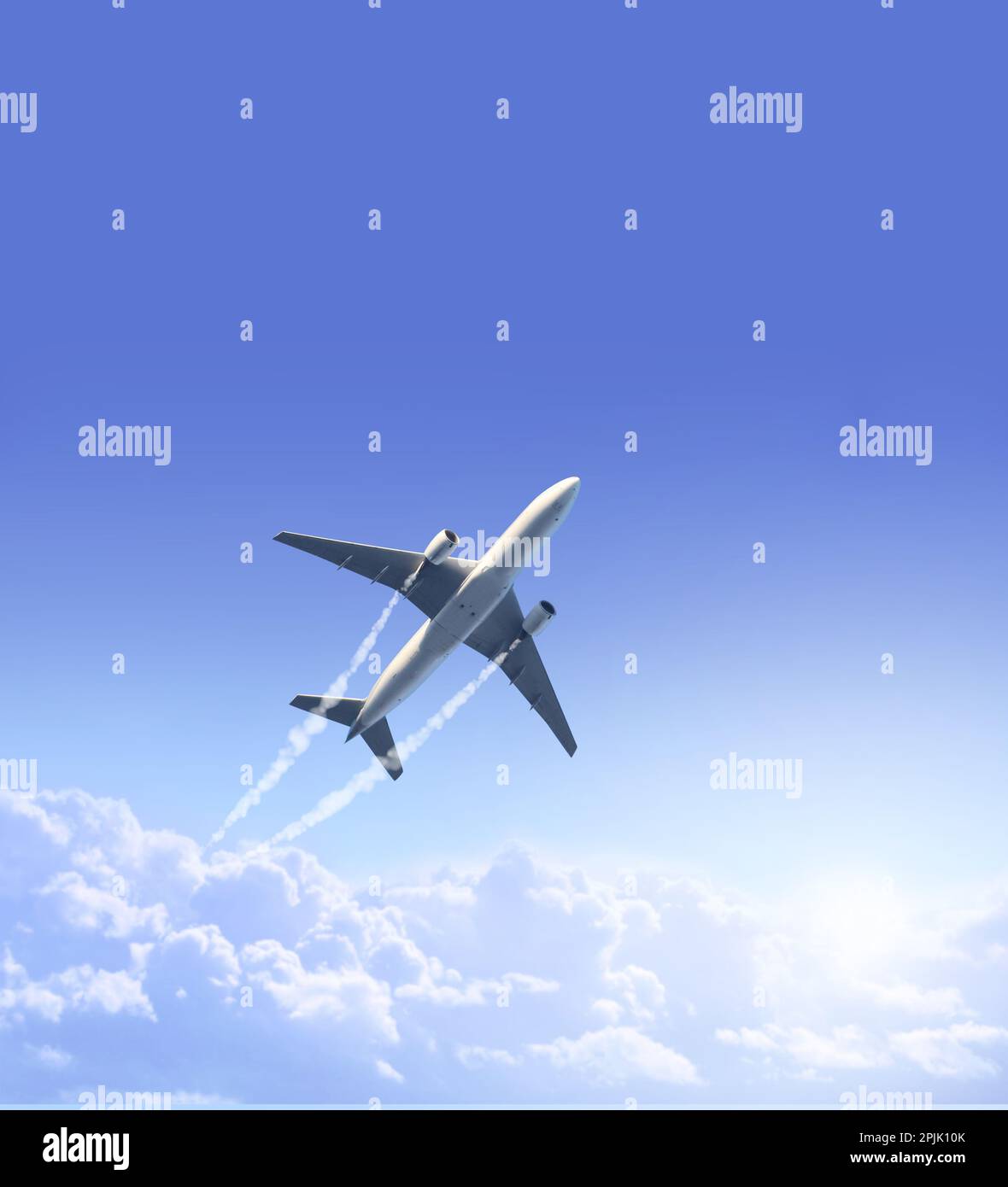 Vertical nature background with aircraft and Jet trailing smoke in the ...