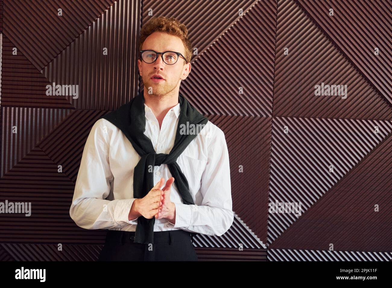 Waiter in uniform. Indoors of new modern luxury restaurant Stock Photo ...