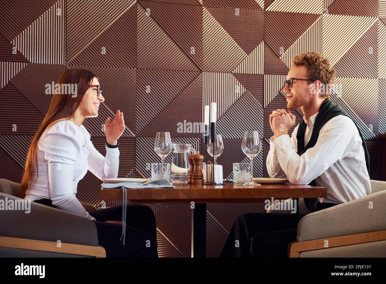 Young boyfriend with adult woman. Indoors of new modern luxury ...
