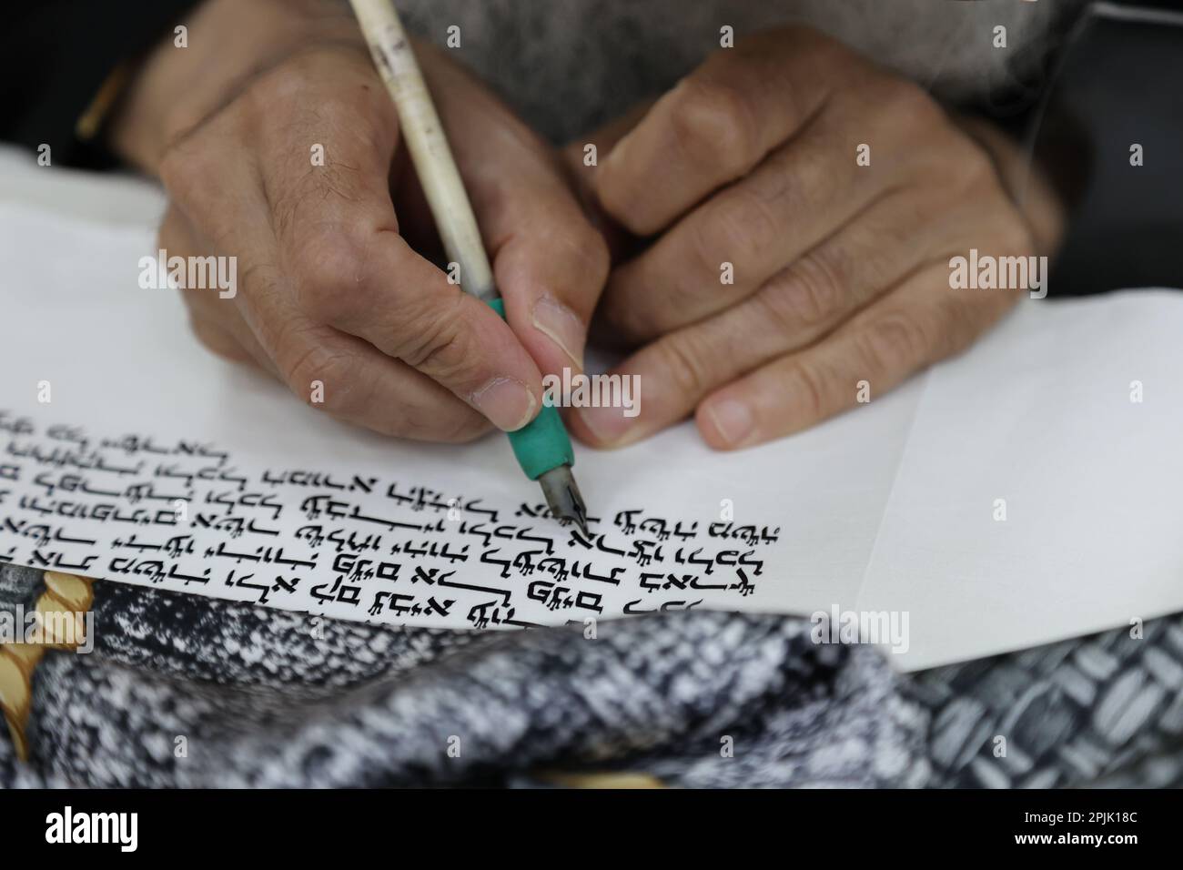 07-07-2022. jerusalem-israel. Writing and correcting the last letters ...