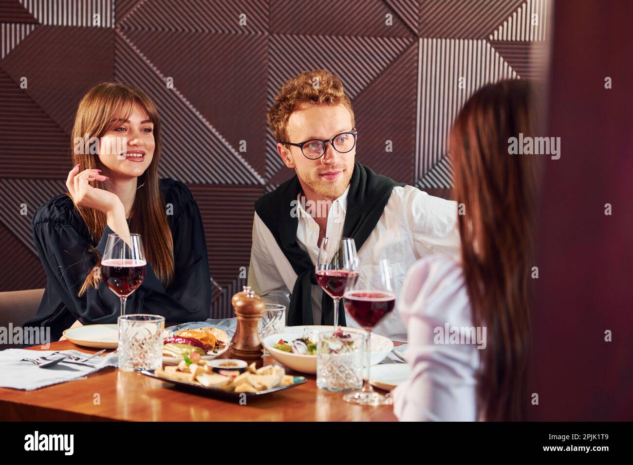 Having conversation. Indoors of new modern luxury restaurant Stock ...