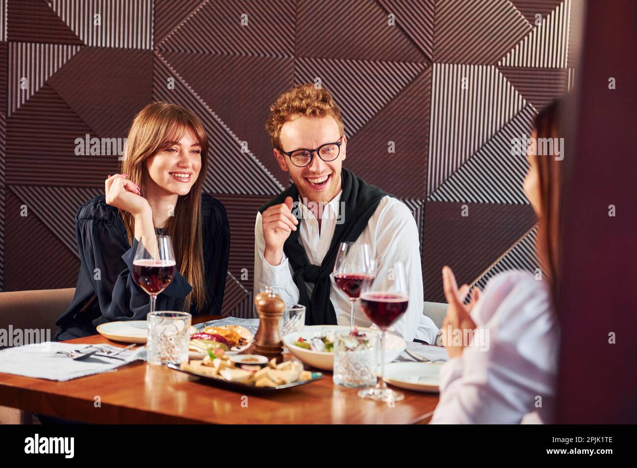 Having conversation. Indoors of new modern luxury restaurant Stock ...