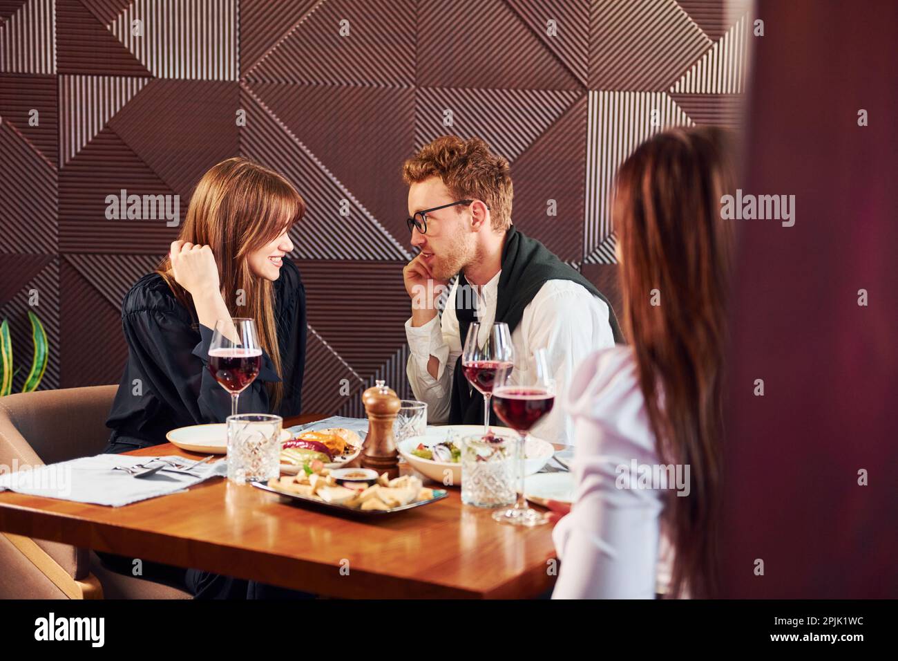Having conversation. Indoors of new modern luxury restaurant Stock ...