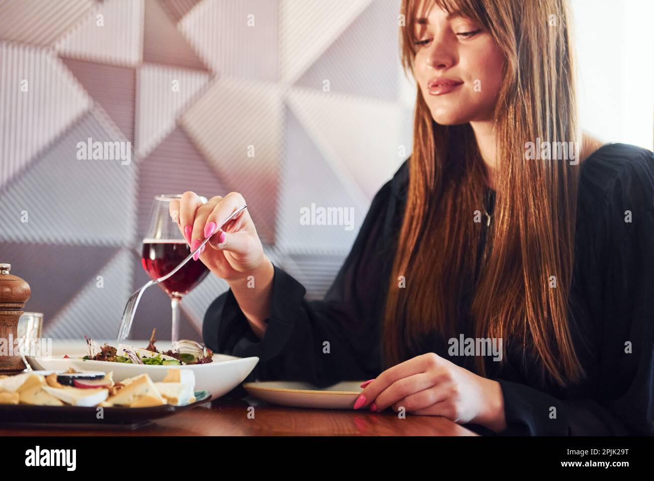 Woman have luxury dinner. Indoors of new modern luxury restaurant Stock ...