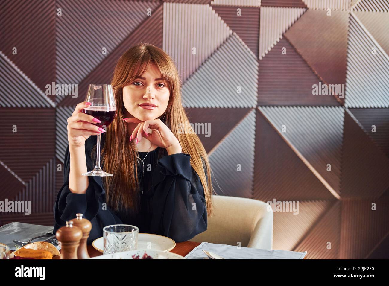 Woman have luxury dinner. Indoors of new modern luxury restaurant Stock ...