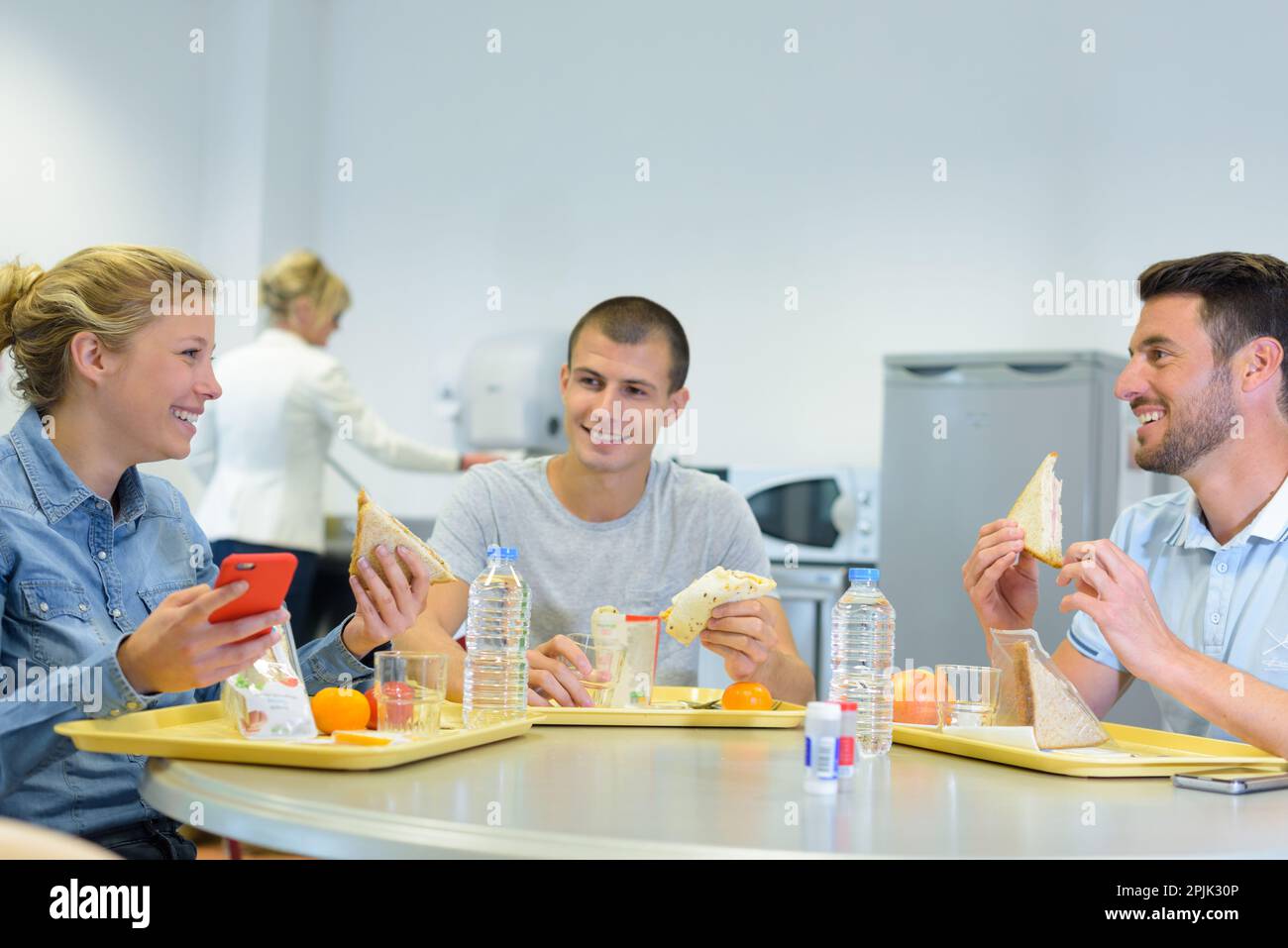a friendly group mates with sandwiches Stock Photo - Alamy